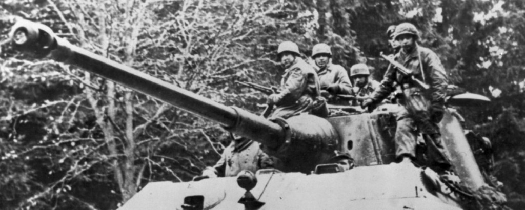 German paratroopers hitch a ride atop a Tiger Royal in the opening ...