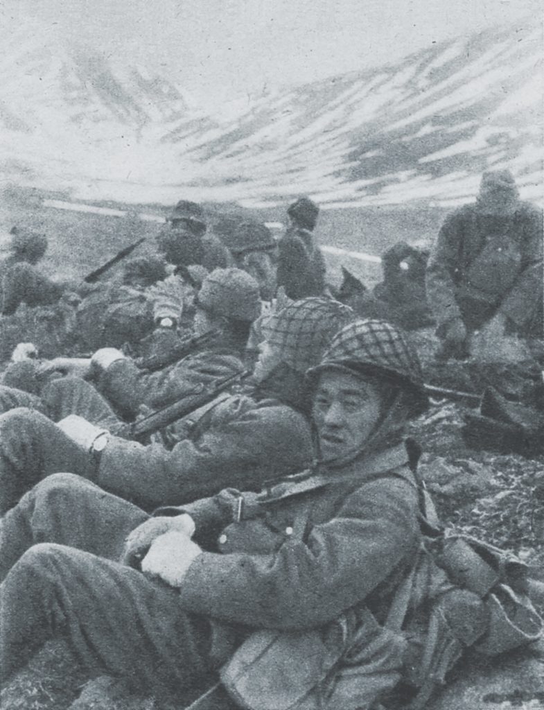 Members of the Japanese 301st Independent Infantry Battalion rest after ...