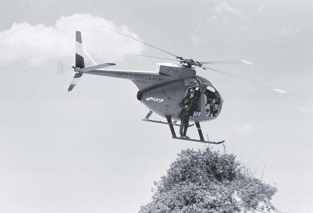 CAYUSE: The gunner of a Hughes OH-6 Cayuse light observation helicopter ...