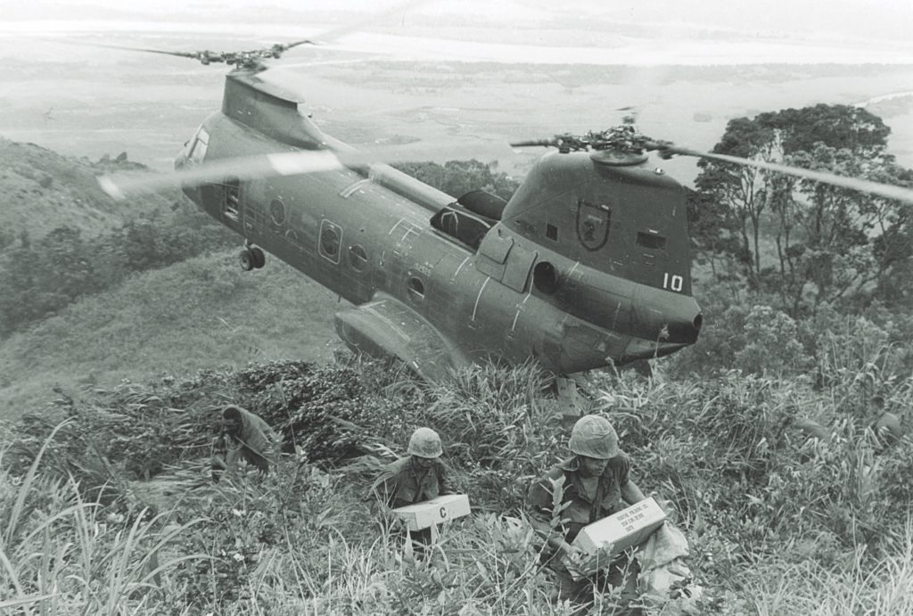 SEA KNIGHT: A Boeing-Vertol CH-46 Sea Knight delivers supplies to a ...