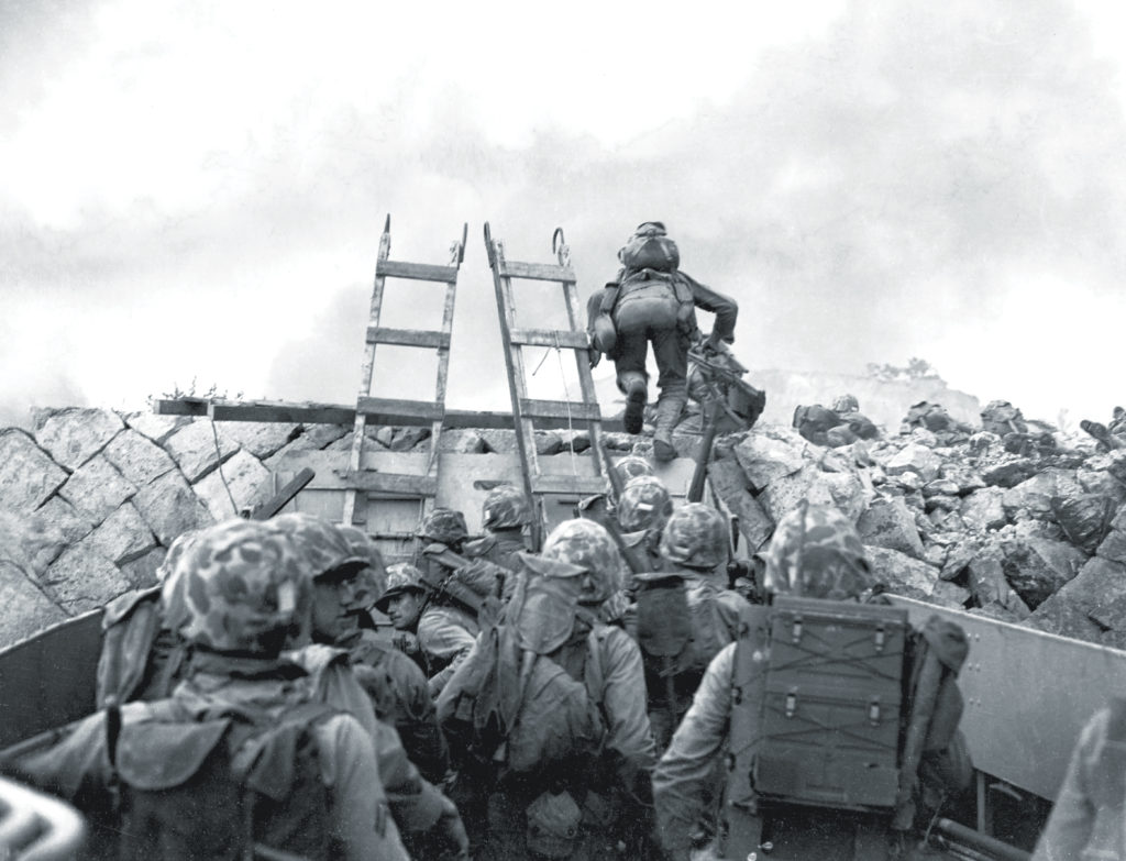 Marines climb scaling ladders to secure a beachhead at Inchon, South ...