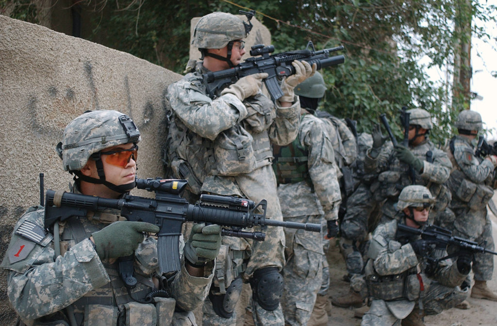Staff Sgt. John Gregory leads a dismounted patrol of 1st ID troops ...